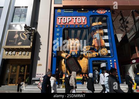 Customers shop at the newly opened flagship store of TOP TOY Tide Play ...