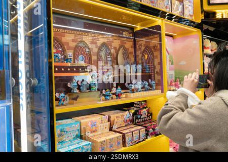 Customers shop at the newly opened flagship store of TOP TOY Tide Play ...