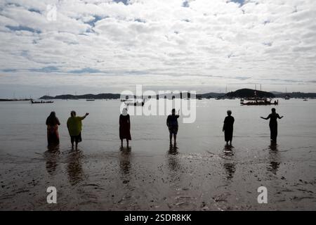 Maori women sing as traditional waka paddle past on Waitangi Day in the ...