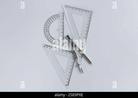 Rulers and compass on light grey background, flat lay Stock Photo - Alamy