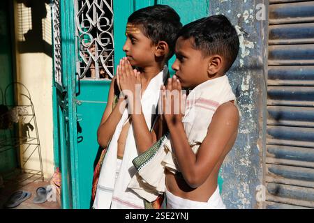 Two boys from the Devanga (weaver's caste) lead a procession to ...