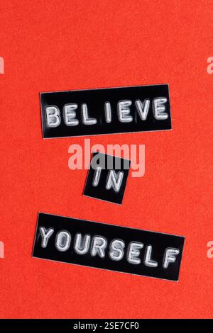 'Believe in yourself' words on lightbox on a white wooden surface, top ...