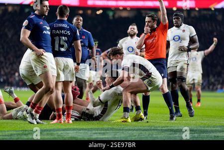 Tommy Freeman of England celebrates his try with teammates during the ...