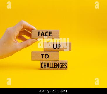 Face up to challenges symbol. Wooden blocks with words Face up to ...