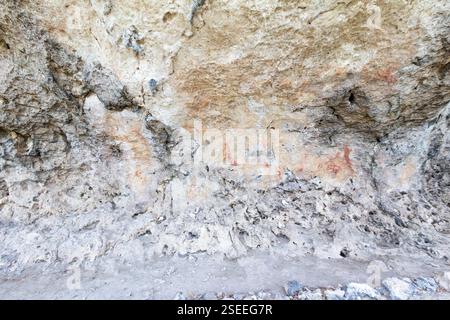 Prehistoric red hematite hand prints on a cave wall at historic Lamanok ...
