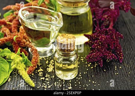 Oil amaranth in gravy boat on wooden board Stock Photo - Alamy
