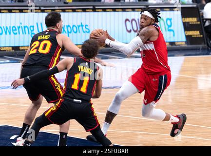 Atlanta Hawks forward Georges Niang (20) sits on the bench during the first half of an NBA ...