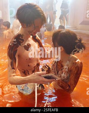 Hakone, Japan. 09th Feb, 2025. Bathers enjoy in a chocolate bath at the ...