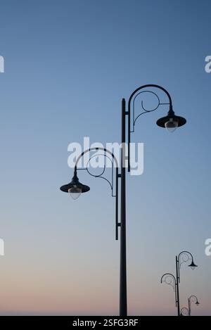 Public street lighting pole with LED lights with sunset color ...