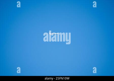 twin engined jet liner aircraft in deep blue sky Stock Photo - Alamy