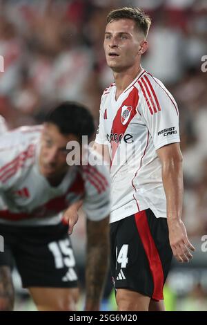 (L to R) River Plate's midfielder Giuliano Galoppo, midfielder Franco ...