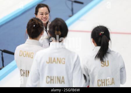 China's Dong Ziqi, front and China's Jiang Jiayi sweep during a match against Japan at the World ...