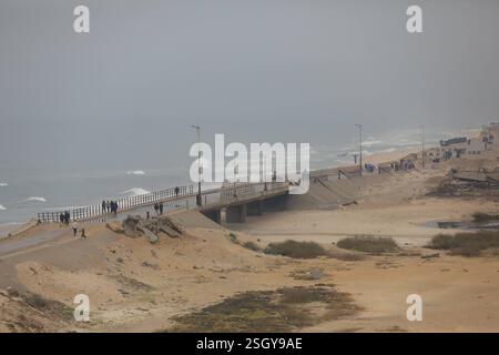 People walk along al-Rashid street between Gaza City and Nuseirat in ...