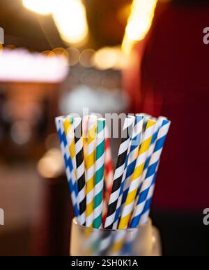 Bright colorful cocktail beverage straws and tubes put together in the ...