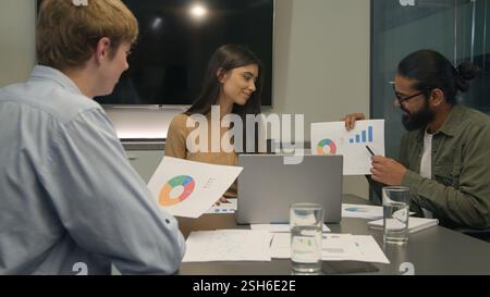 Businessman showing graphic on diagram Stock Photo - Alamy
