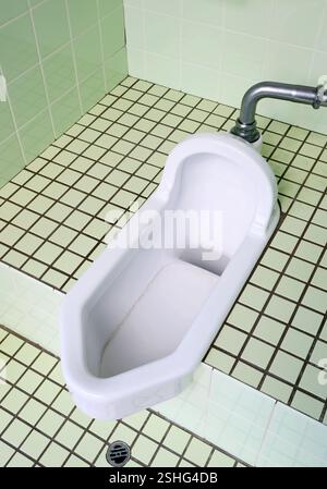 Traditional Japanese old style squat toilet in the house Stock Photo ...