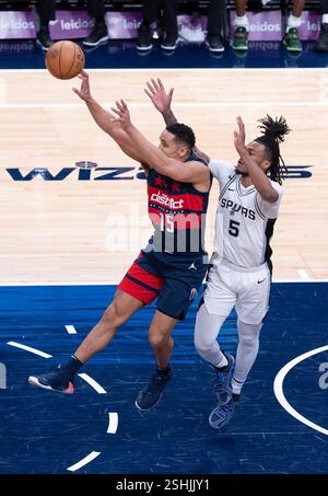 San Antonio Spurs guard Stephon Castle (5), center, shoots during the ...