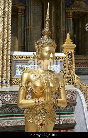 Golden Kinnari statue at Temple of Emerald Buddha (Wat Phra Kaew) in ...