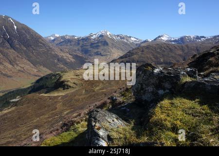 Ben Nevis and the surrounding hills with snow remaining on the summits ...