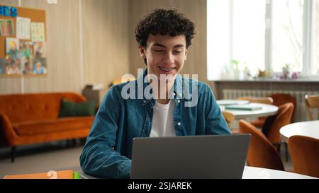 Happy Teenage Schoolboy Using Laptop Stock Photo - Alamy