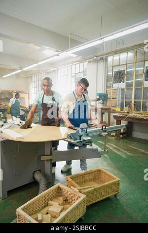 Group of craftsmen working in woodshop Stock Photo - Alamy