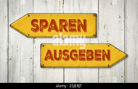 The words save and spend on wooden cube push buttons. Financial ...