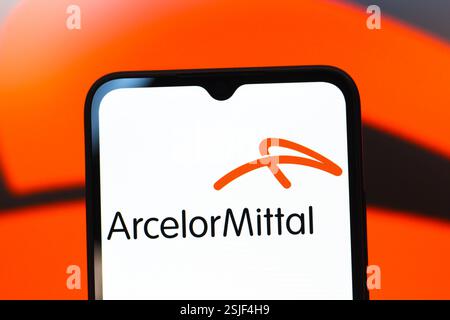 In this photo illustration, the ArcelorMittal logo is seen displayed on ...