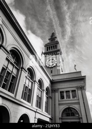The image showcases a tall, San Francisco Ferry Building clock tower ...