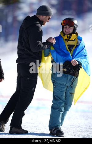The Duke of Sussex speaks with a competitor at the Alpine Skiing and ...