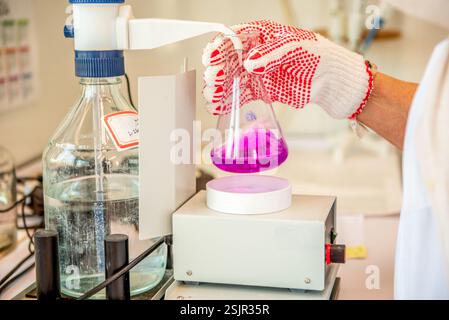 Manual titration station with brown bottle. Laboratory equipment ...