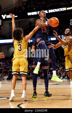Vanderbilt guard Tyler Tanner (3) shoots the ball over Auburn center ...