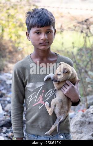 Poor boy collecting garbage in his sack to earn his livelihood, The ...