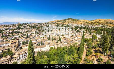 Panoramic view of Granada city against mountains, Andalusia, Spain ...