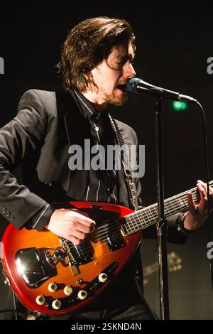 Nick O'Malley of The Arctic Monkeys performing at Revolution Live Fort ...