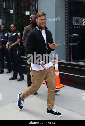 Singer Ricky Martin gets rushed by a fan as he leaves Build Series on ...