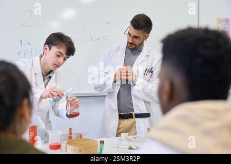 Students and teacher making experiments in chemistry laboratory Stock ...
