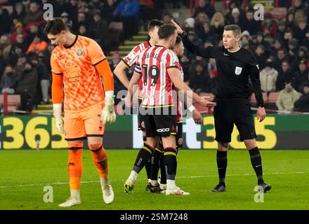 Sheffield United's Jack Robinson and referee John Busby during the Sky ...