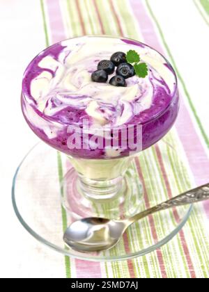 Cornflakes with fruits and a spoon on tablecloth Stock Photo - Alamy