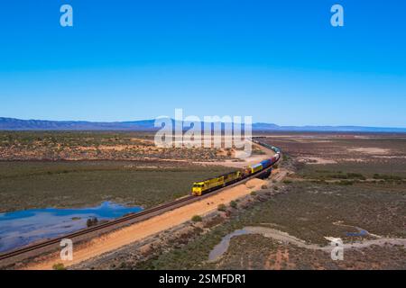 Aerial of freight train leaving Spencer Junction Rail Yard Port Augusta ...