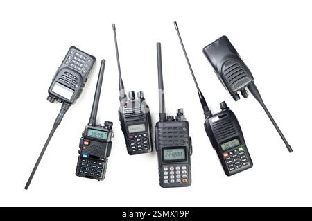 Multiple handheld radios arranged on a white background showcasing ...