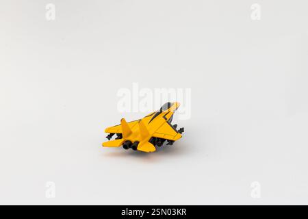 Yellow and Black Toy Jet on White Background Stock Photo - Alamy