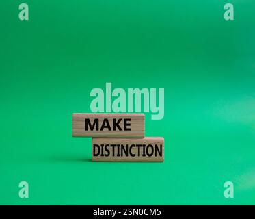 Make distinction symbol. Concept words make distinction on wooden ...