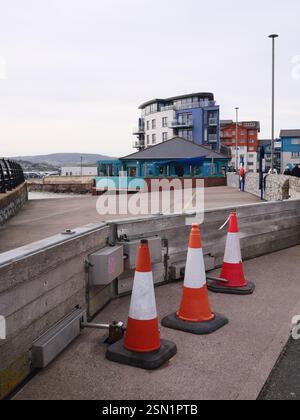 Tidal flooding defence flood gates closed across boat ramp entrance ...