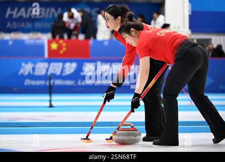 China's Dong Ziqi, front and China's Jiang Jiayi sweep during a match against Japan at the World ...