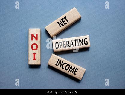 NOI - Net Operating Income symbol. Concept word NOI on wooden cubes ...