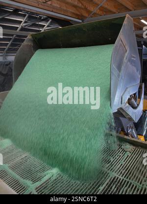 Shovel working at a distribution and storage centre for fertilizers ...