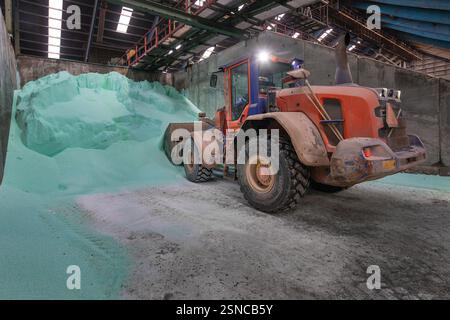 Shovel working at a distribution and storage centre for fertilizers ...