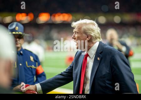 President Donald J. Trump attends Superbowl LIX between the ...