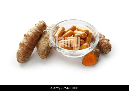 Turmeric rhizomes and capsules isolated on white Stock Photo - Alamy