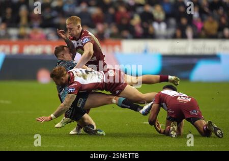 Wigan Warriors' Adam Keighran (left) is tackled by Hull KR's Mikey ...